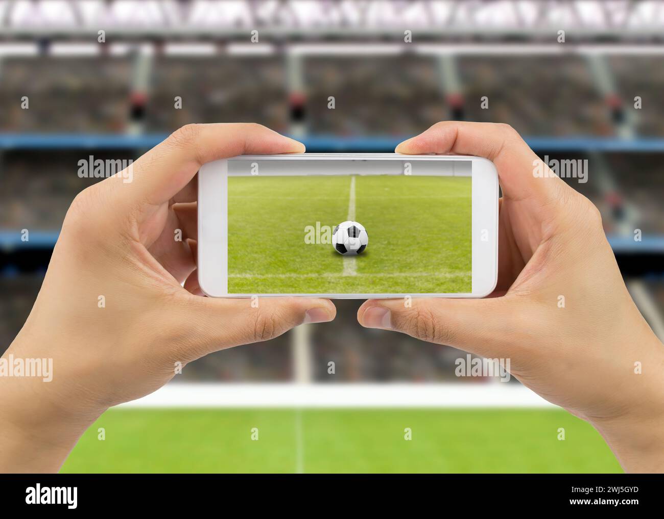 Man holding camera phone stadium hi-res stock photography and images ...