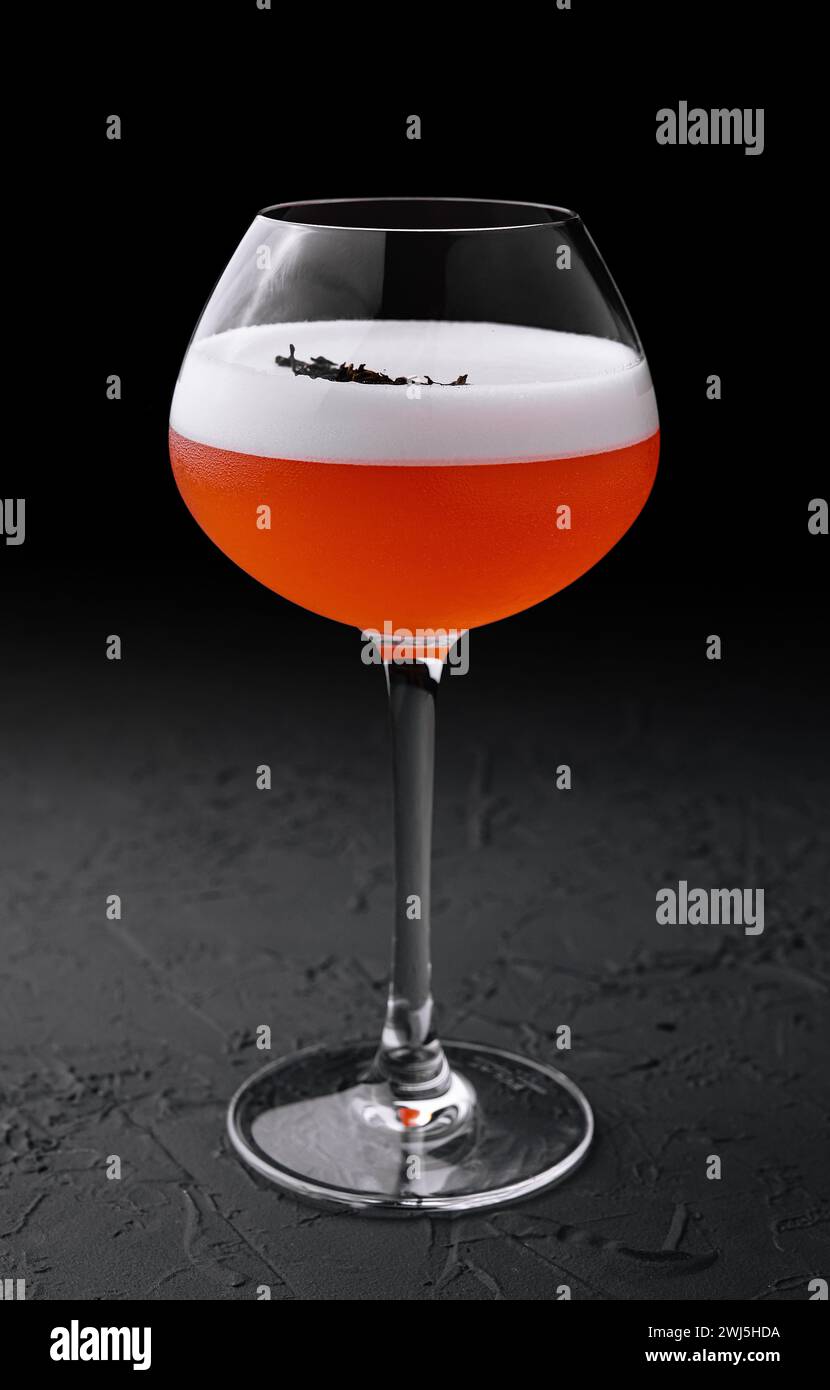 Refreshing alcoholic cocktail with egg foam in a glass Stock Photo - Alamy
