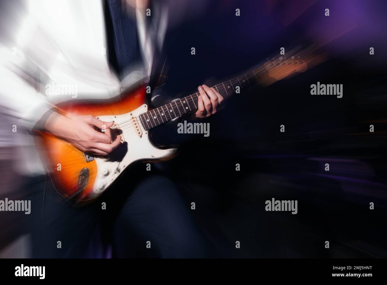 Rock band studio rehearsal. Male musician playing bass guitar before ...