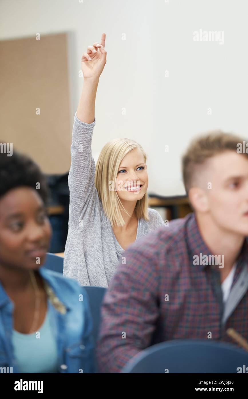 Female student hand up answer hi-res stock photography and images - Alamy