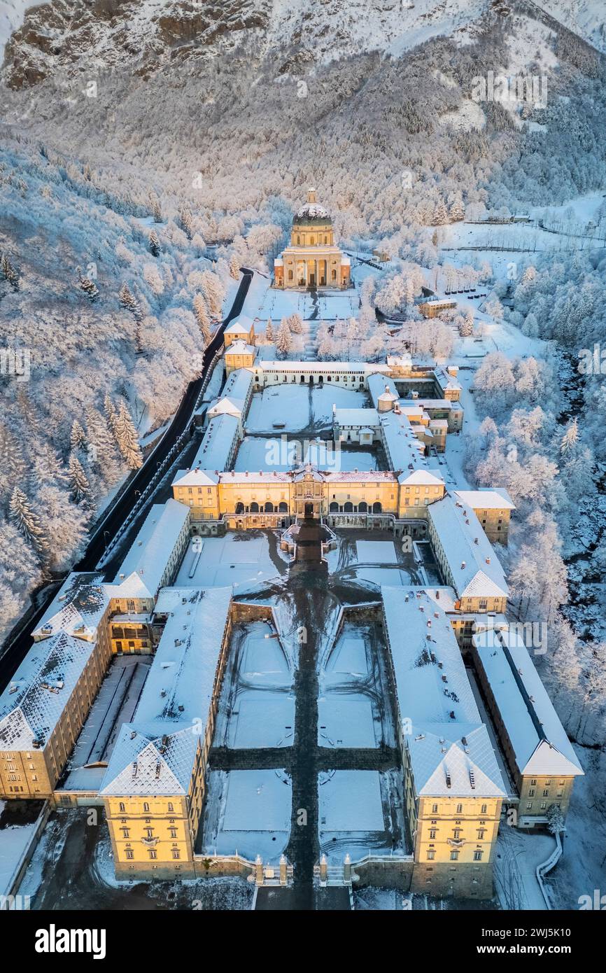 Aerial view of the Sanctuary of Oropa in winter at dawn. Biella, Biella ...