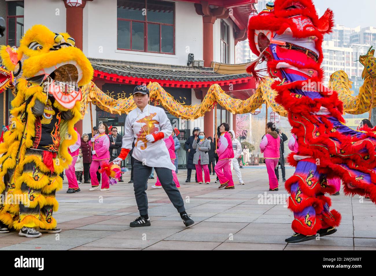 People perform dragon and lion dance on the first day of the Lunar New ...