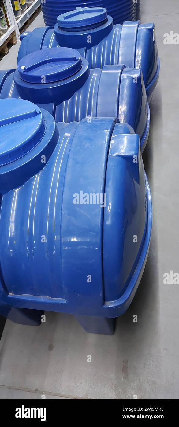 Blue plastic containers for liquid Stock Photo - Alamy