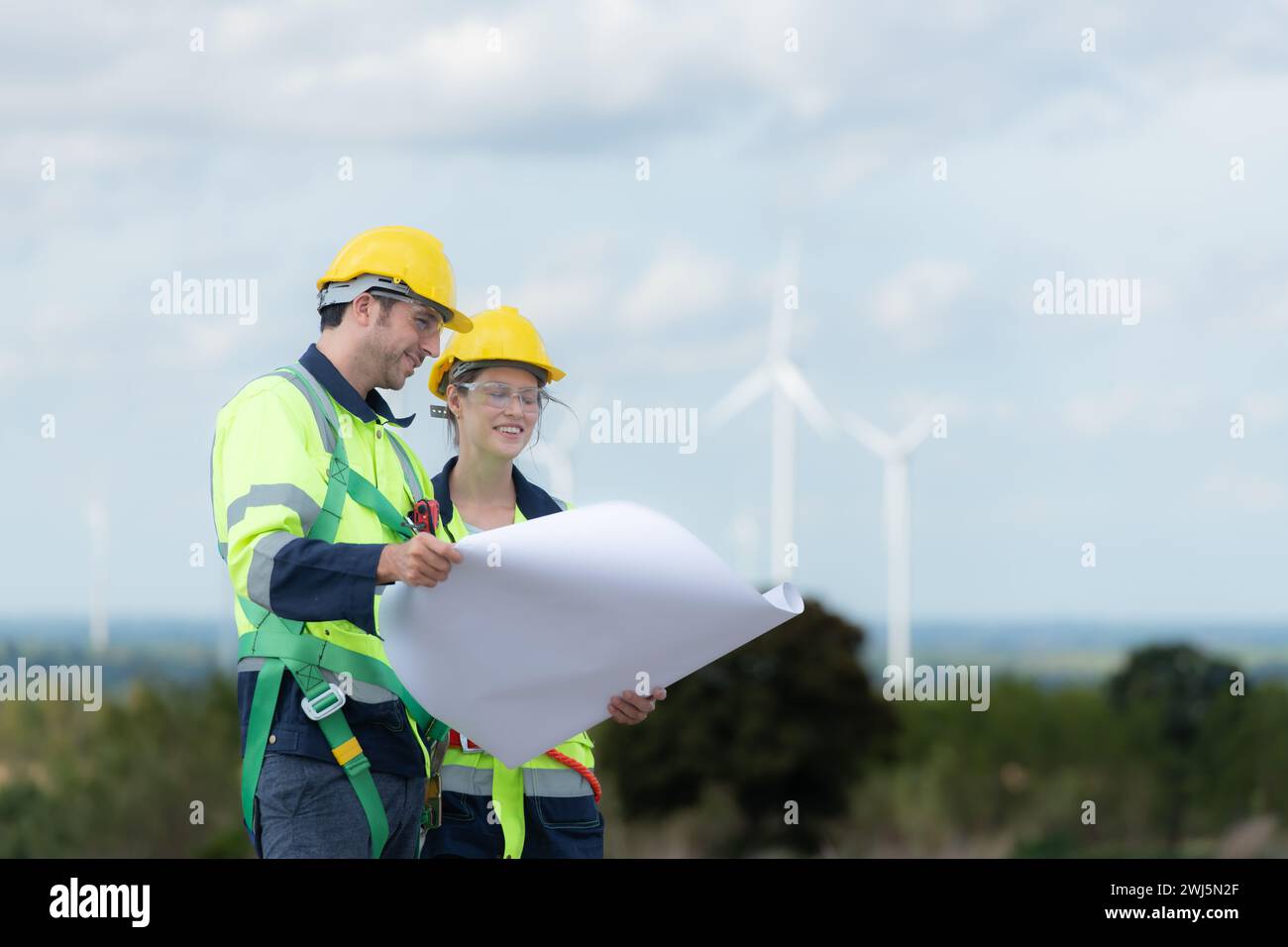 Engineer and technician discussing a solution problem of wind turbine ...