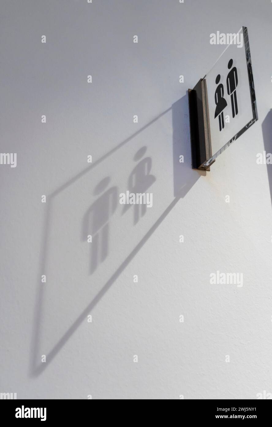 Transparent sign, indication of toilets, WC, with shade Stock Photo - Alamy