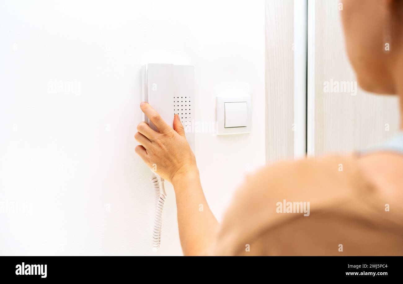 Using of intercom device at home Stock Photo - Alamy