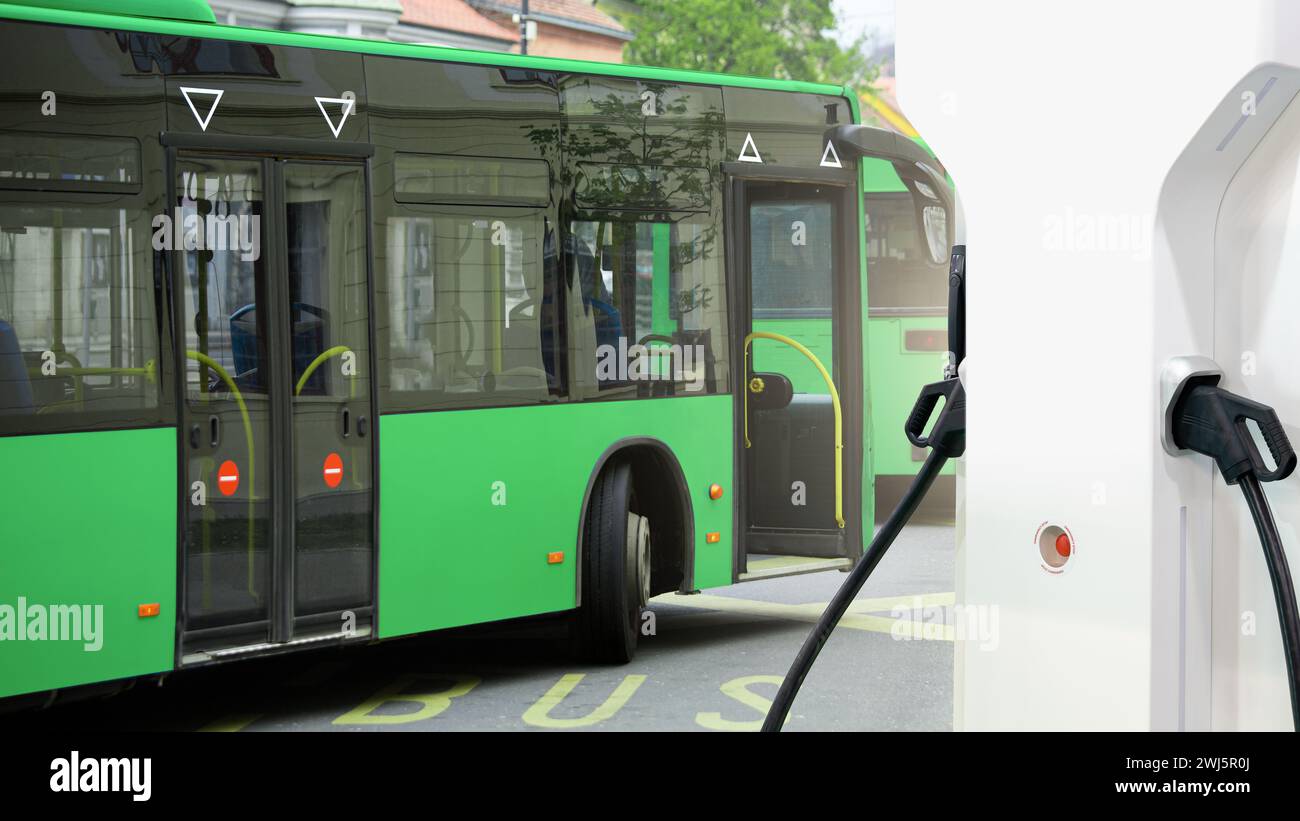 Electric buses with charging station Stock Photo - Alamy