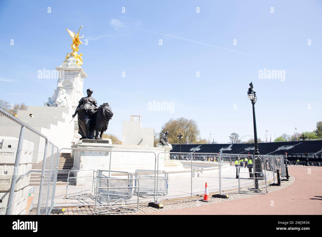Workers are seen on the structures around the Queen Victoria Memorial ...