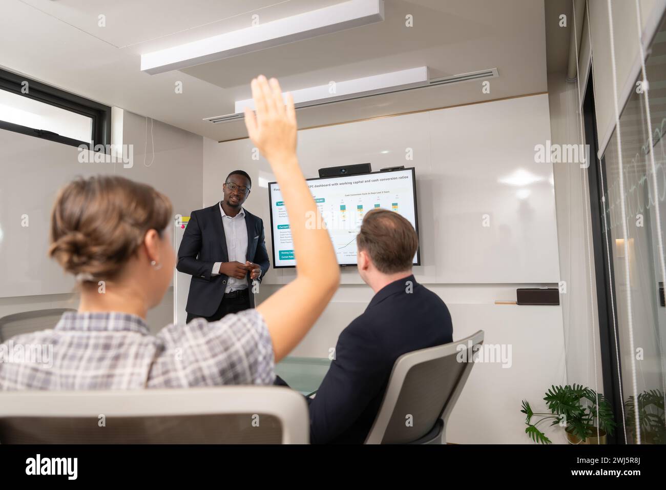 Businessman giving presentation to colleagues in conference room ... Businessman giving presentation to colleagues in conference room ...
