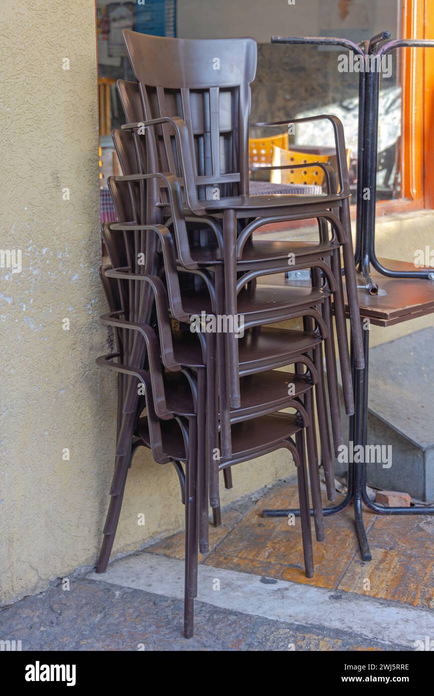 Stack of Brown Chairs and Tables in Front of Restaurant Stock Photo - Alamy