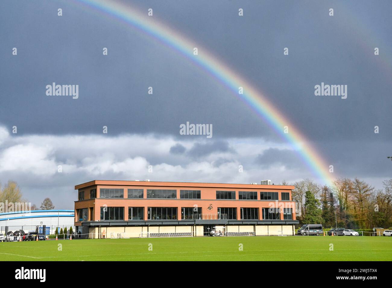 A stunning rainbow arches over the main academy building at the Swansea ...