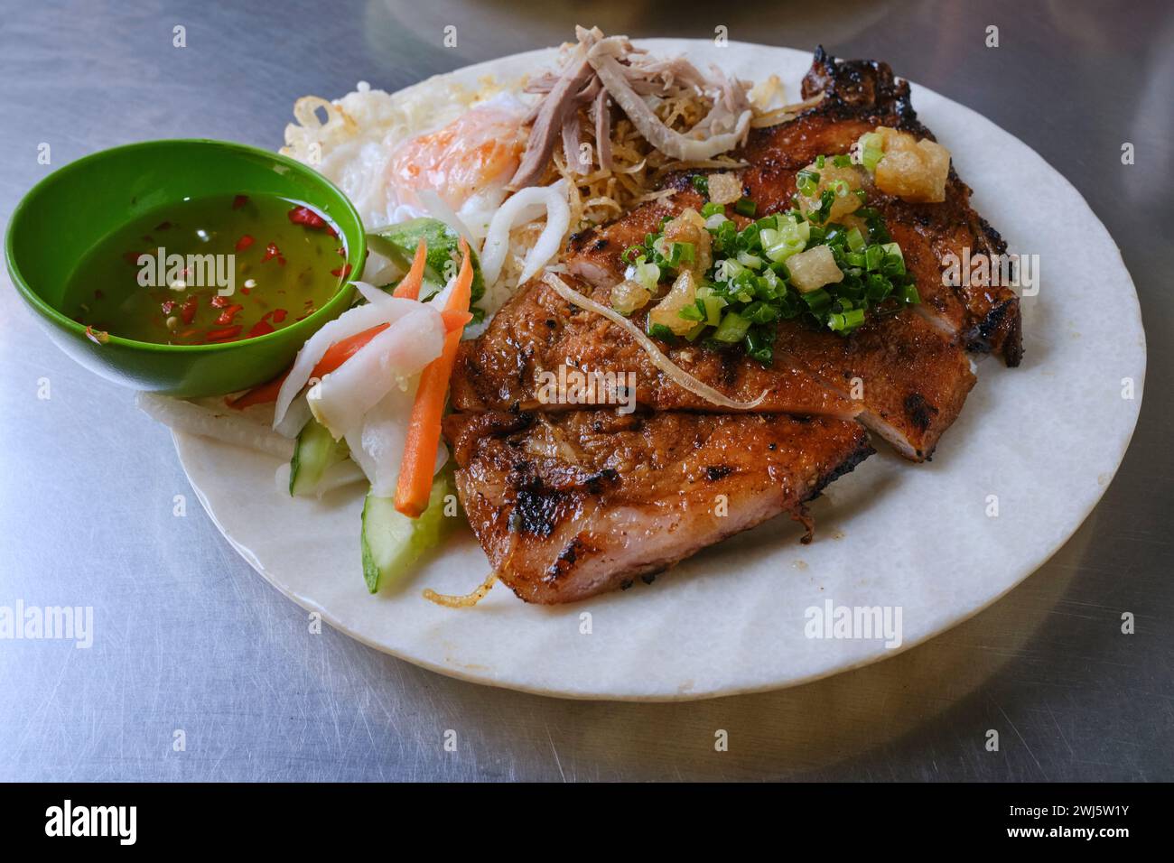 Vietnamese broken rice dish (com tam / cơm tấm), served with grilled ...