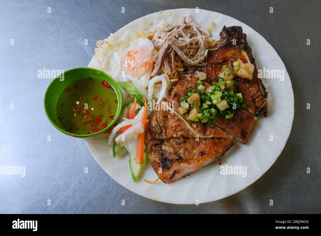 Vietnamese broken rice dish (com tam / cơm tấm), served with grilled ...