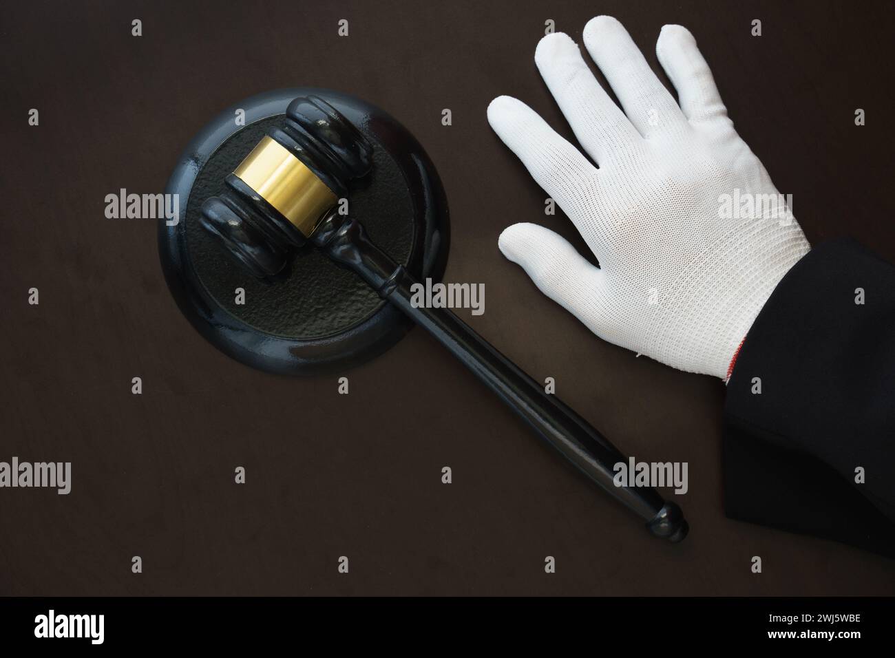 Judge hand and gavel taken from top Stock Photo - Alamy