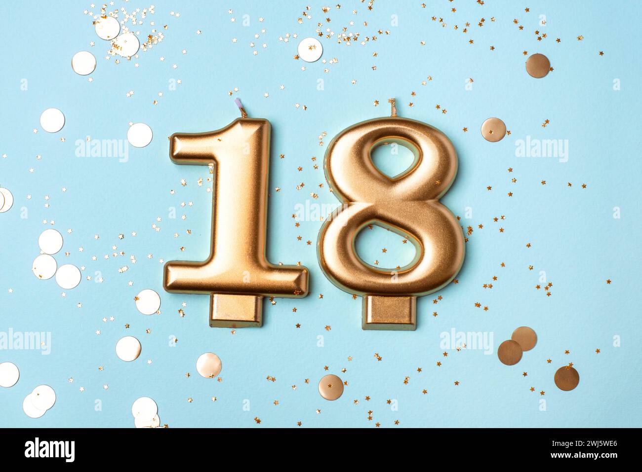 Gold candles in the form of number eighteen Stock Photo - Alamy