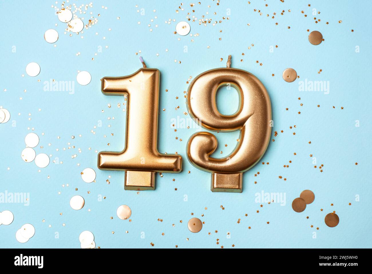 Gold candles in the form of number nineteen Stock Photo - Alamy