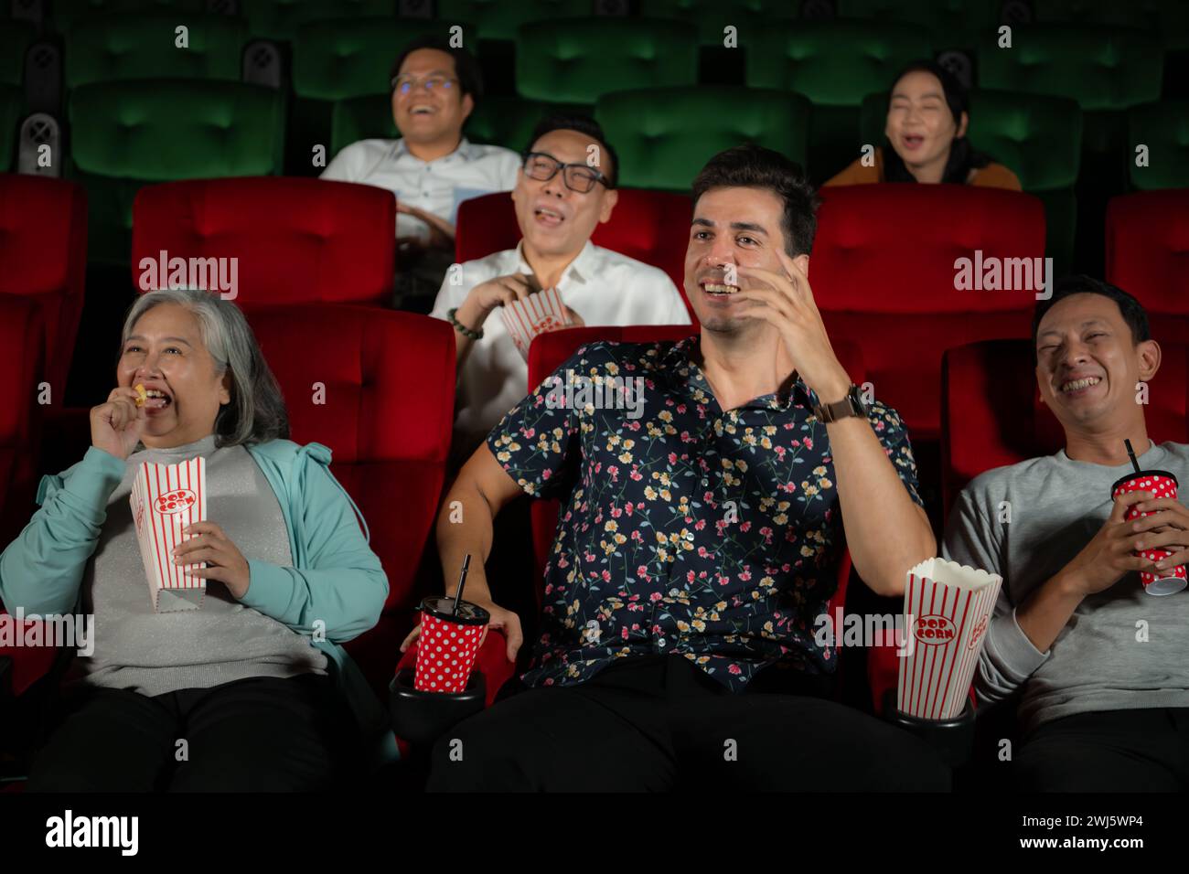 Group of asian senior friends watching comedy movie and laugh at the ...