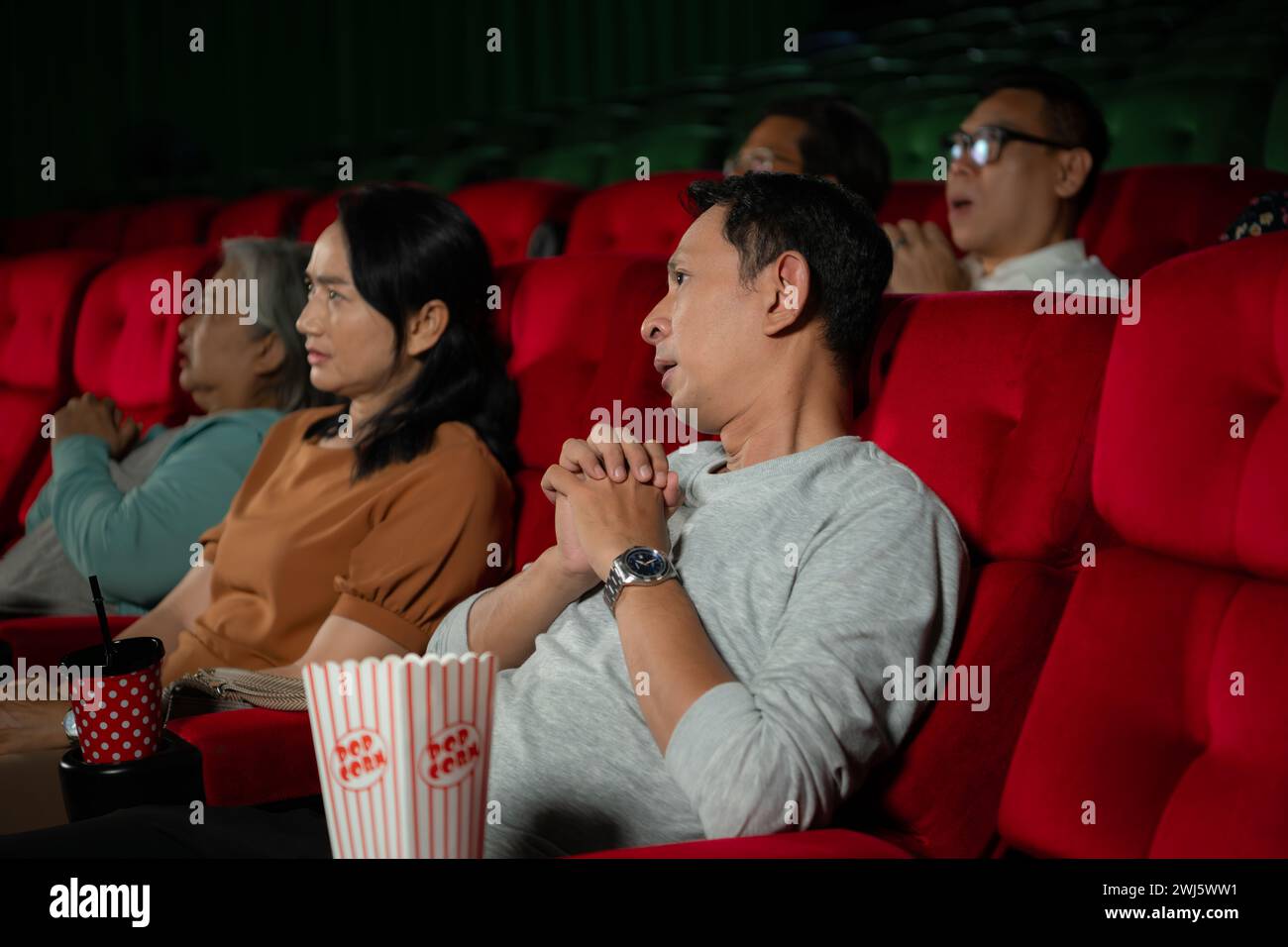 Group of asian senior friends watching comedy movie and laugh at the ...