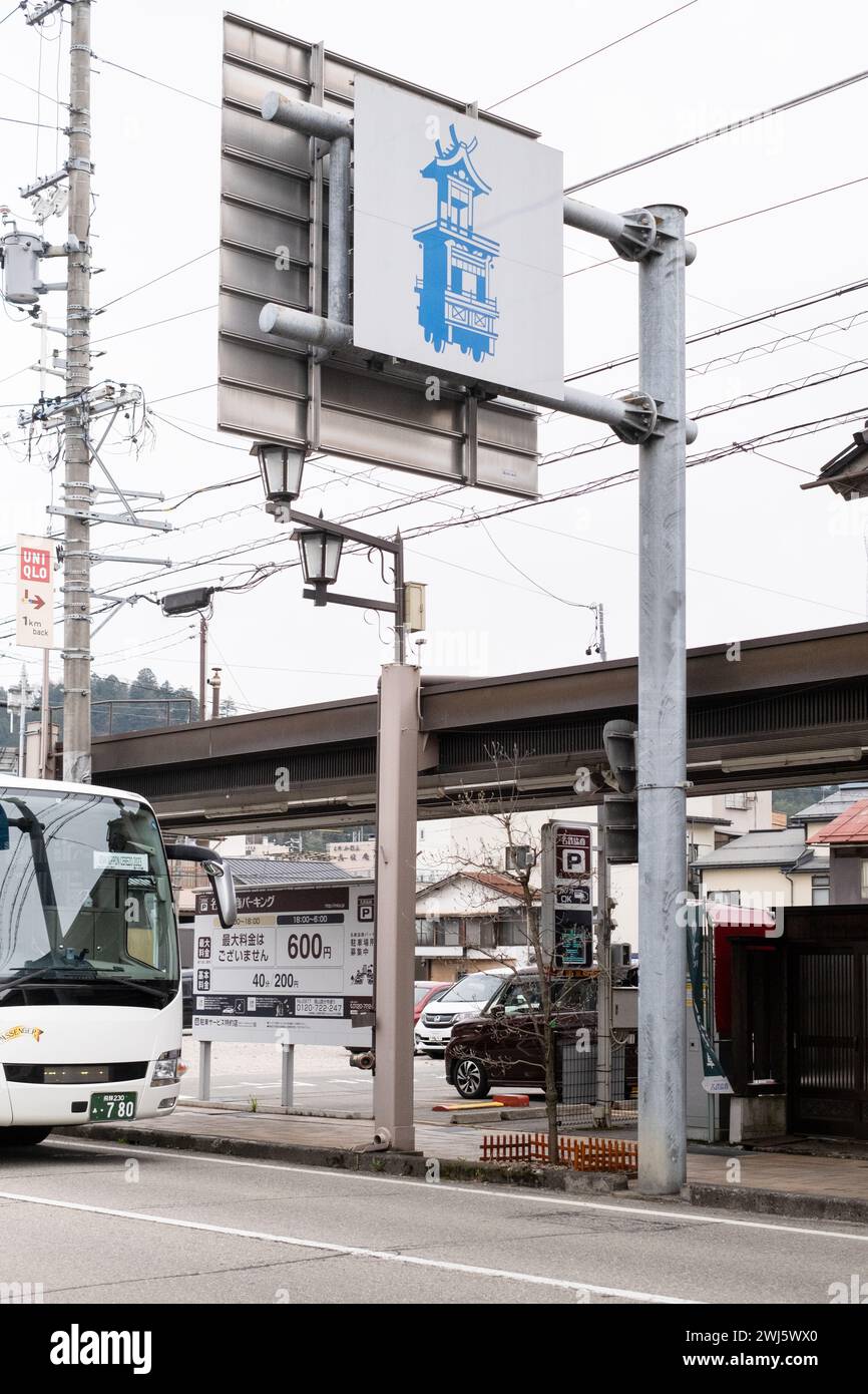 Street scene with roadsign indicating the route of the floats in the ...