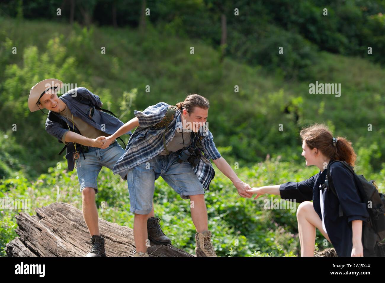 Group of friend on a sunny day in the forest Young group hiker with ...