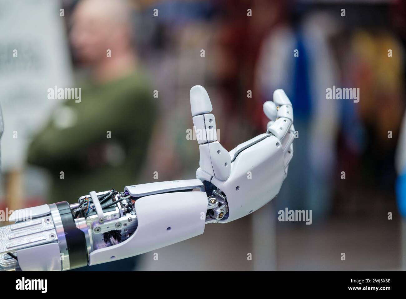 A close-up of a robotic arm with intricate technology, contrasting with ...