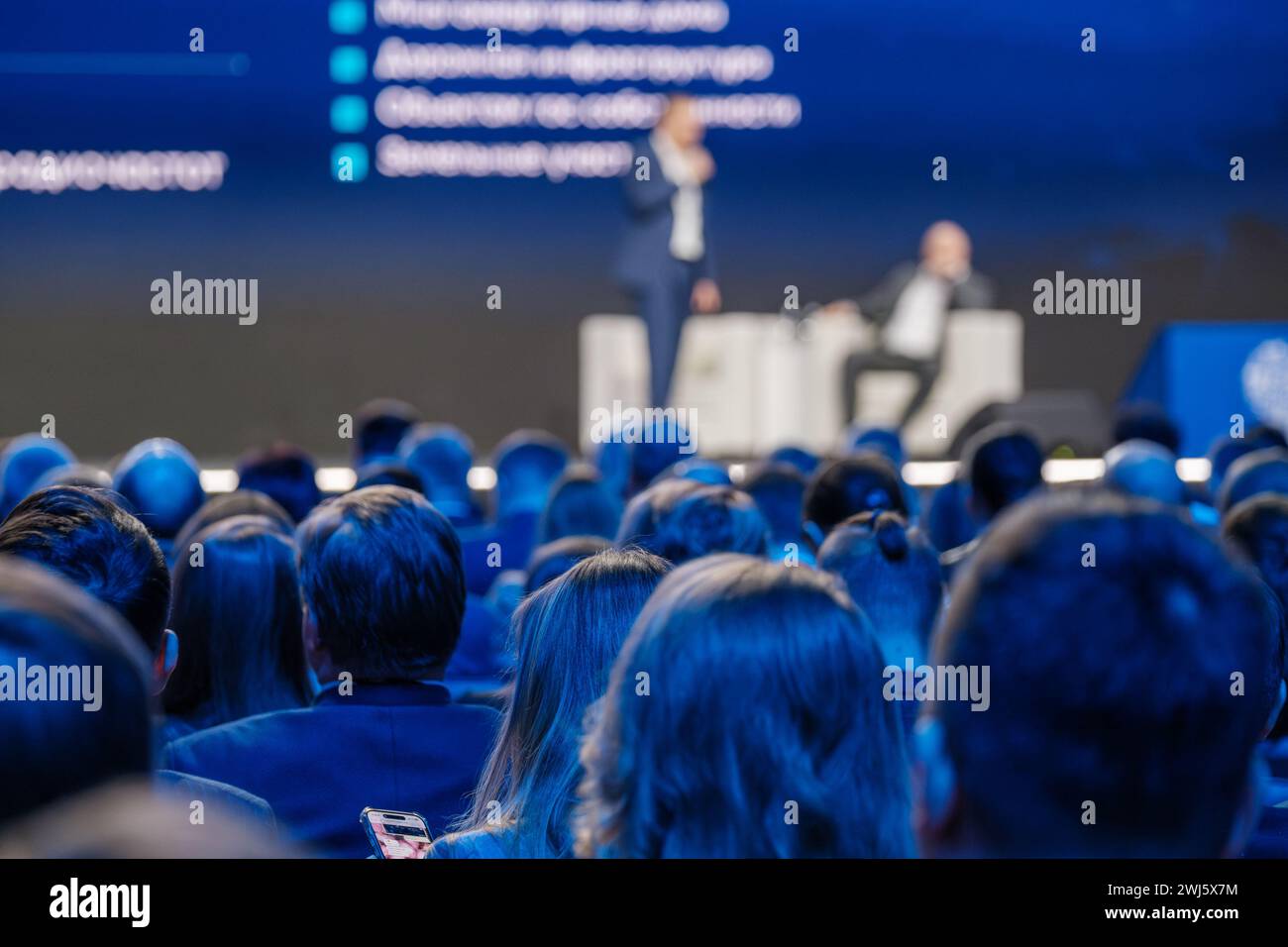 Focused audience at a business conference listening to an expert ...