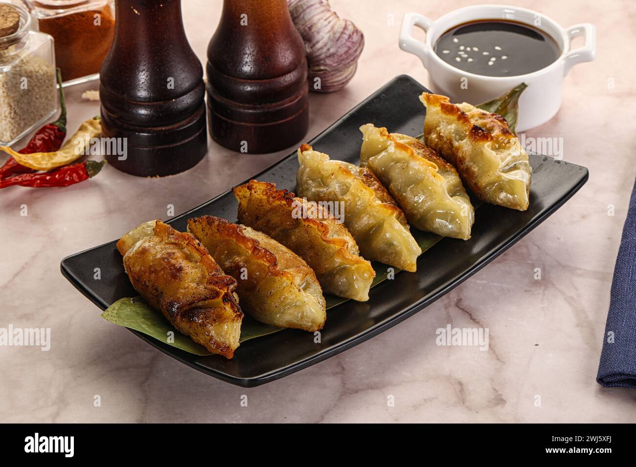 Fried Japanese stuffed dumplings - Gyoza with meat Stock Photo - Alamy