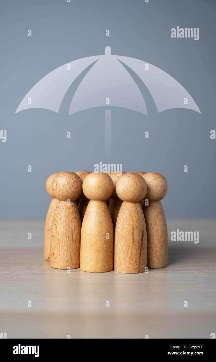A group of people and an umbrella above. The concept of insurance and ...