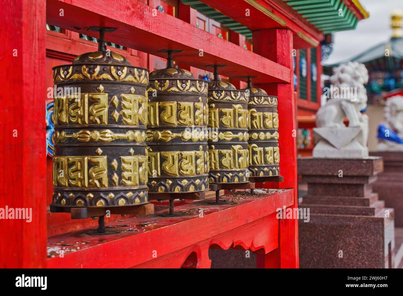 Red Buddhist prayer drums with close-up mantras in Buddhism temple ...