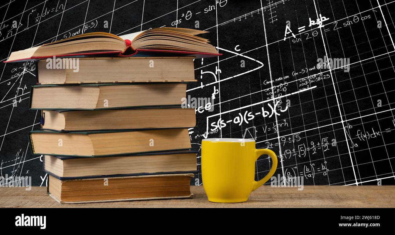 Yellow mug and books on a table with math equations on a moving ...