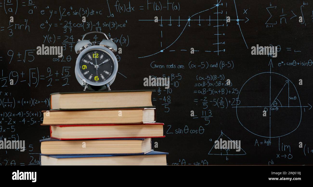 Silver clock on books with math equations in the dark background Stock ...