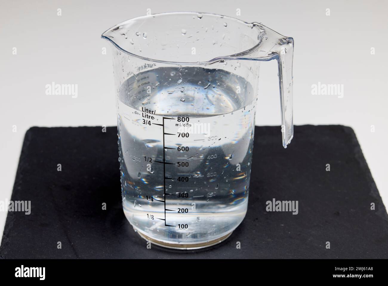 a container with graduated water for measurement Stock Photo - Alamy