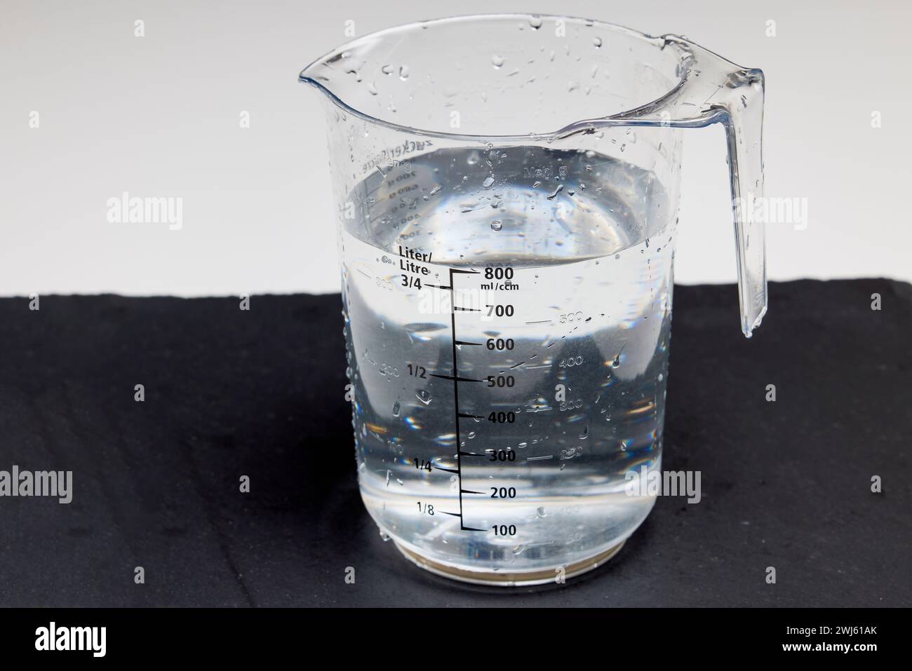 a container with graduated water for measurement Stock Photo - Alamy