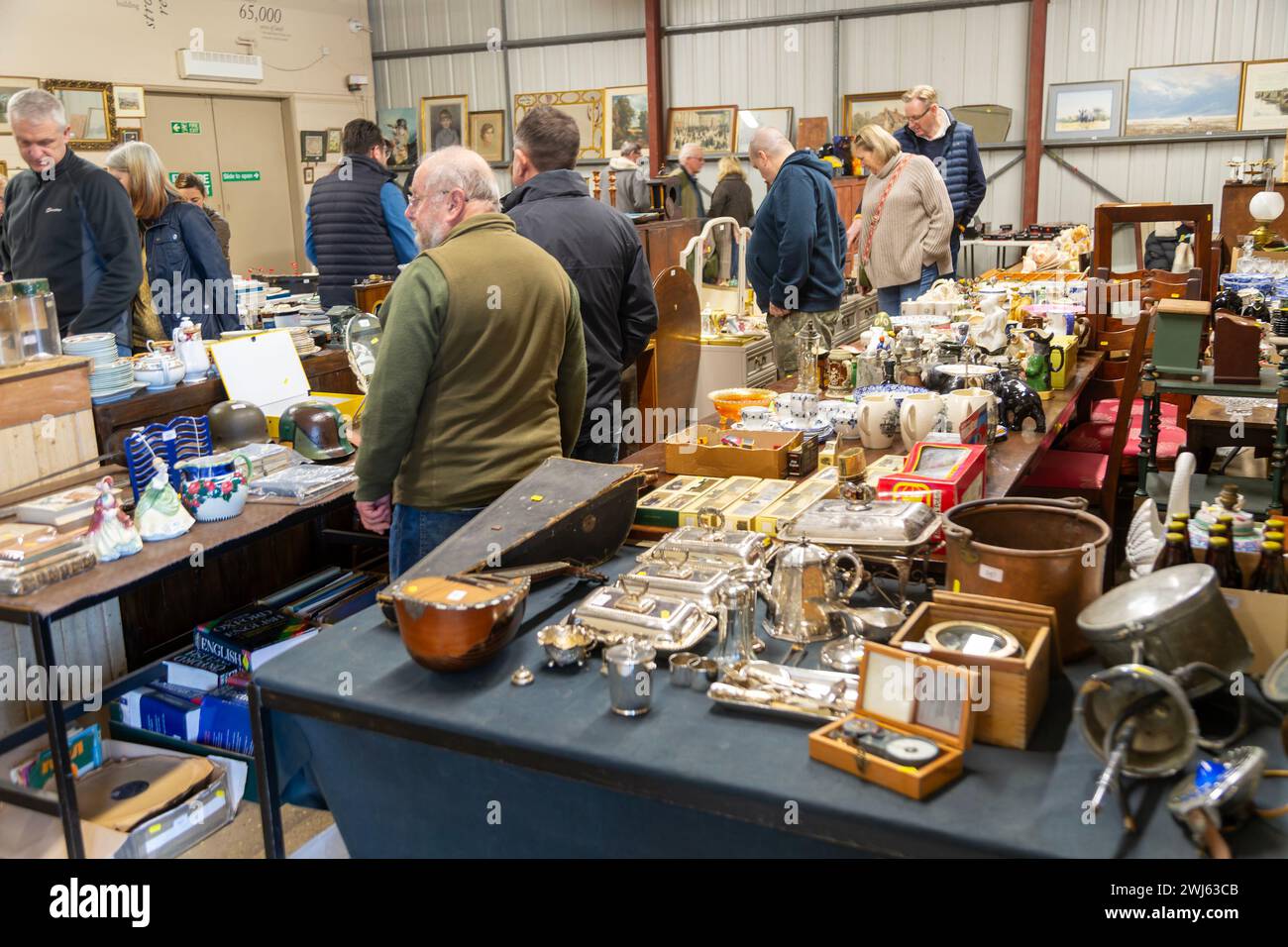 People viewing lots on display at auction room viewing, Campsea Ashe ...