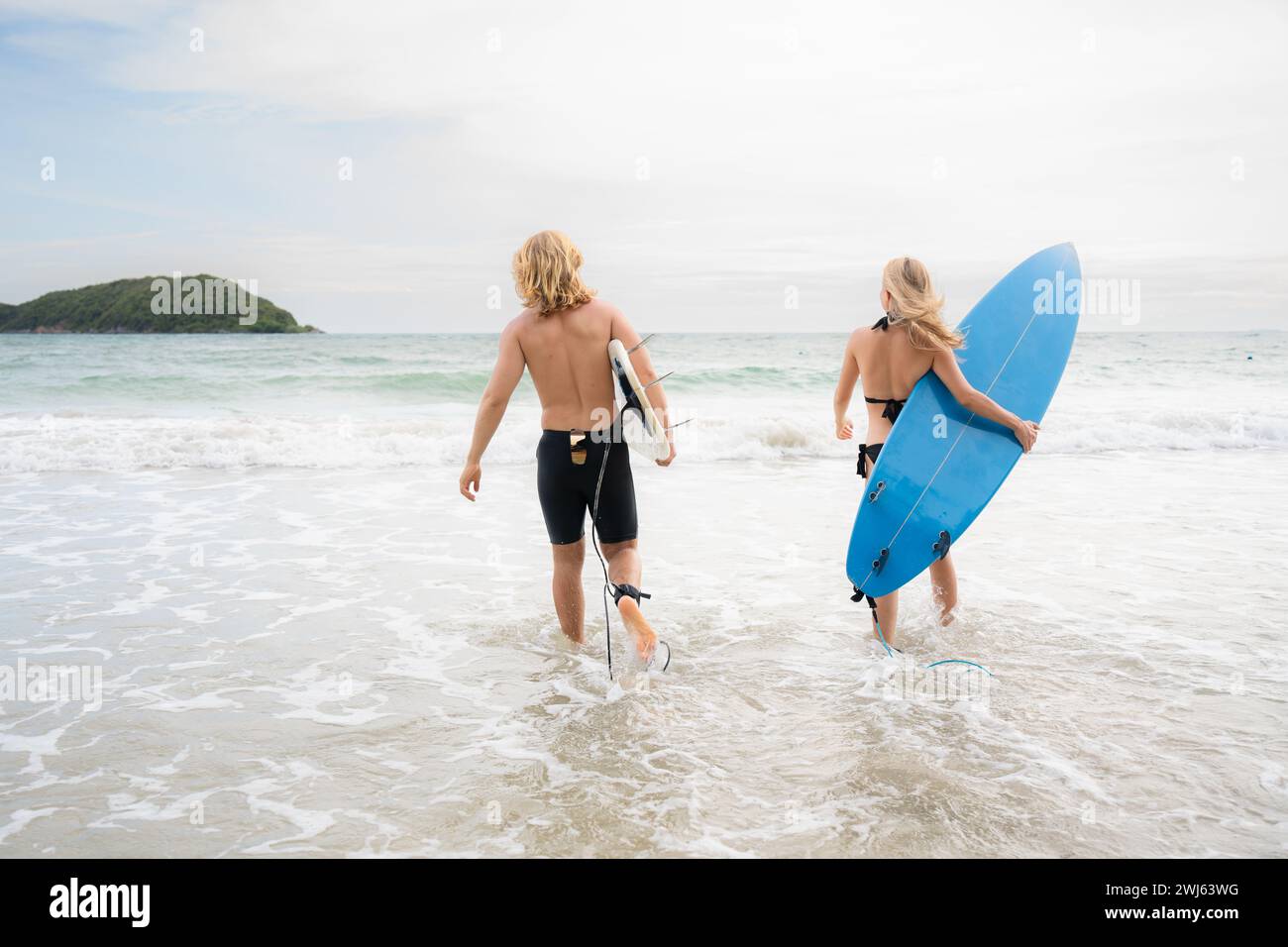 Group young surfers holding surfboards hi-res stock photography and ...