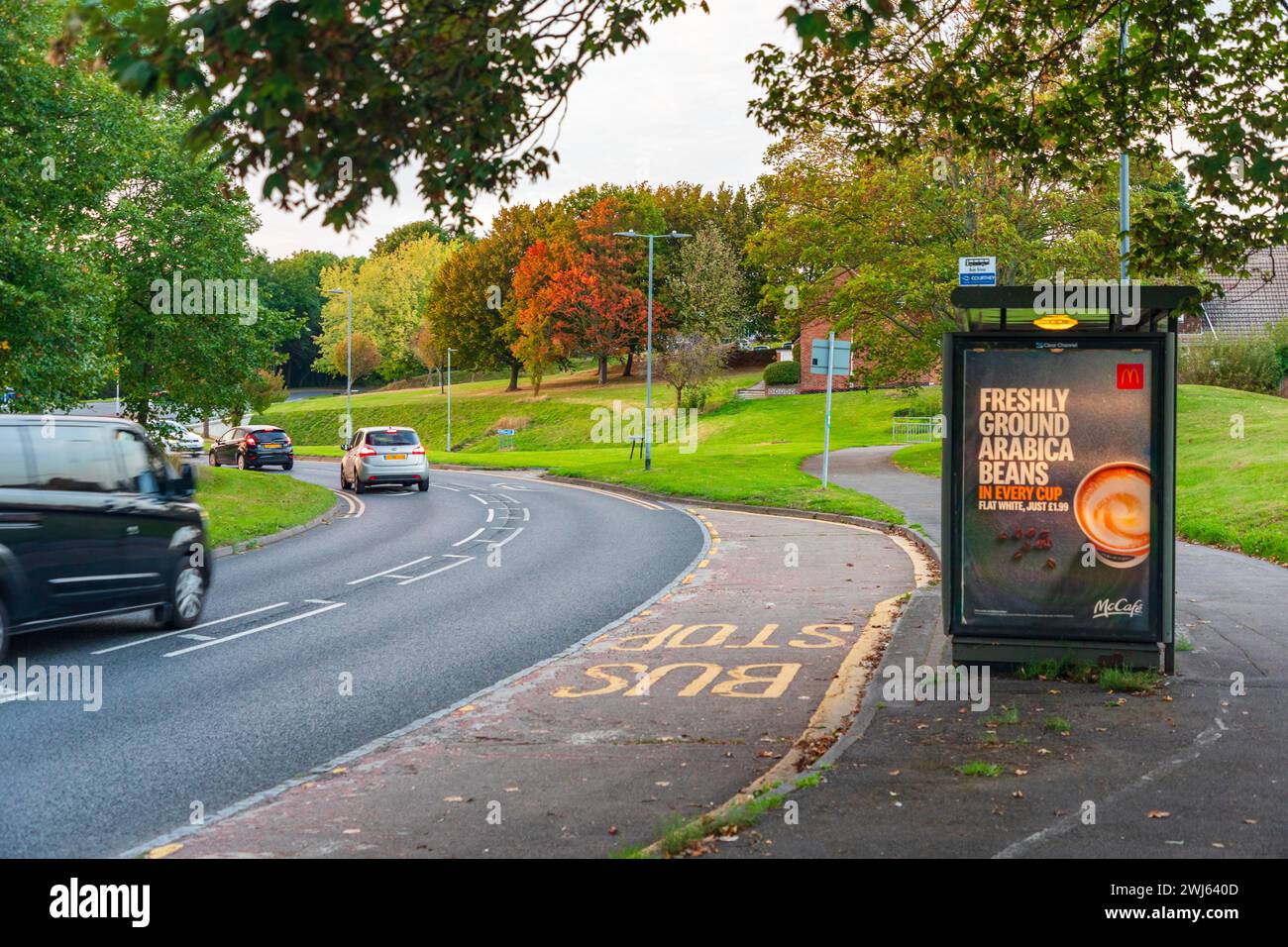 Cars passing Bus Stop at Crowthorne Road, Bracknell, Berkshire Stock ...