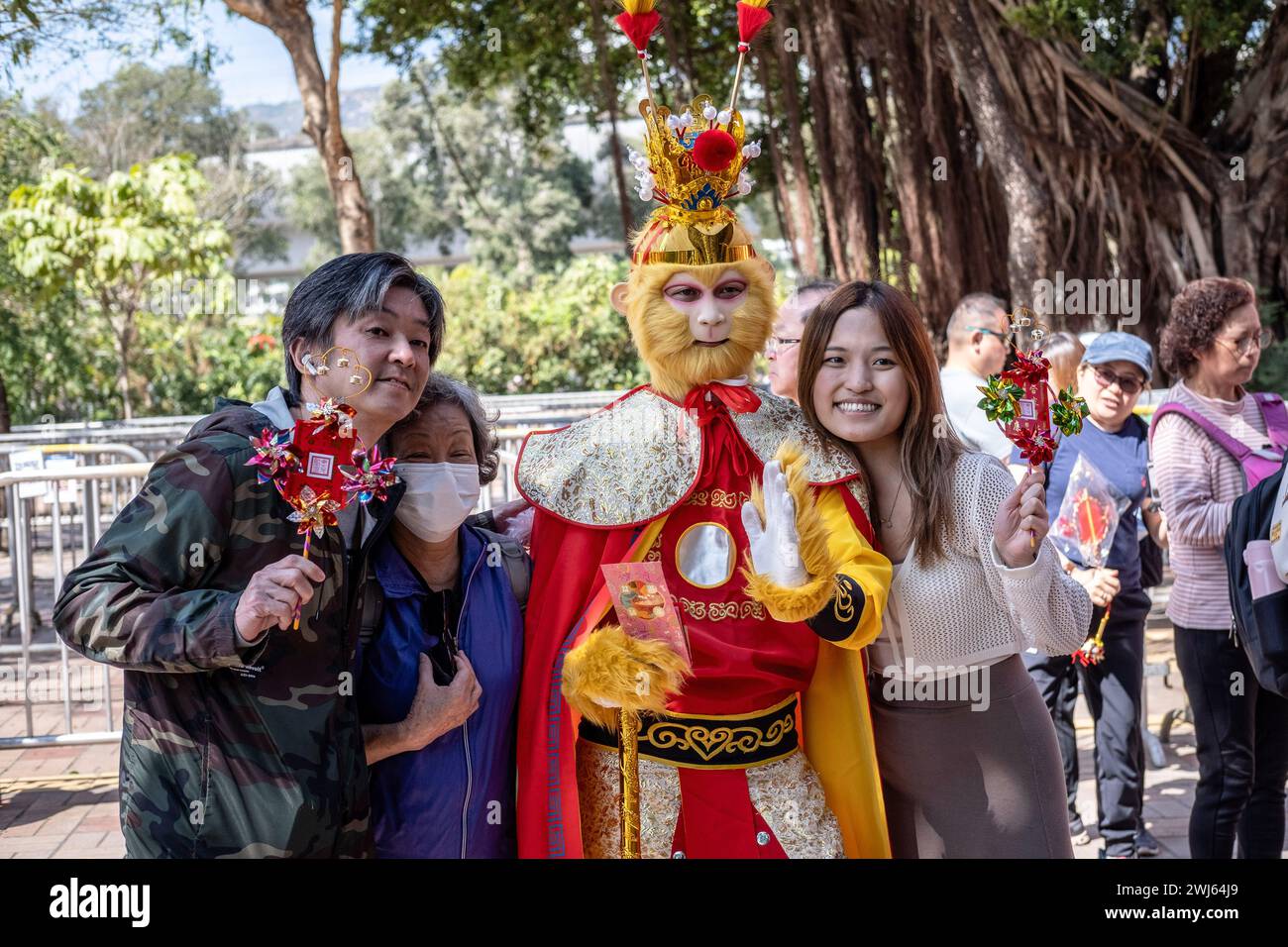 Hong Kong, China. 12th Feb, 2024. People pose for a photo with a ...