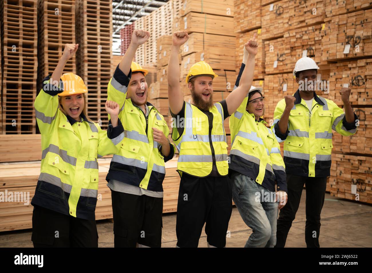 Group of workers in a large timber factory, Have fun by raising your ...
