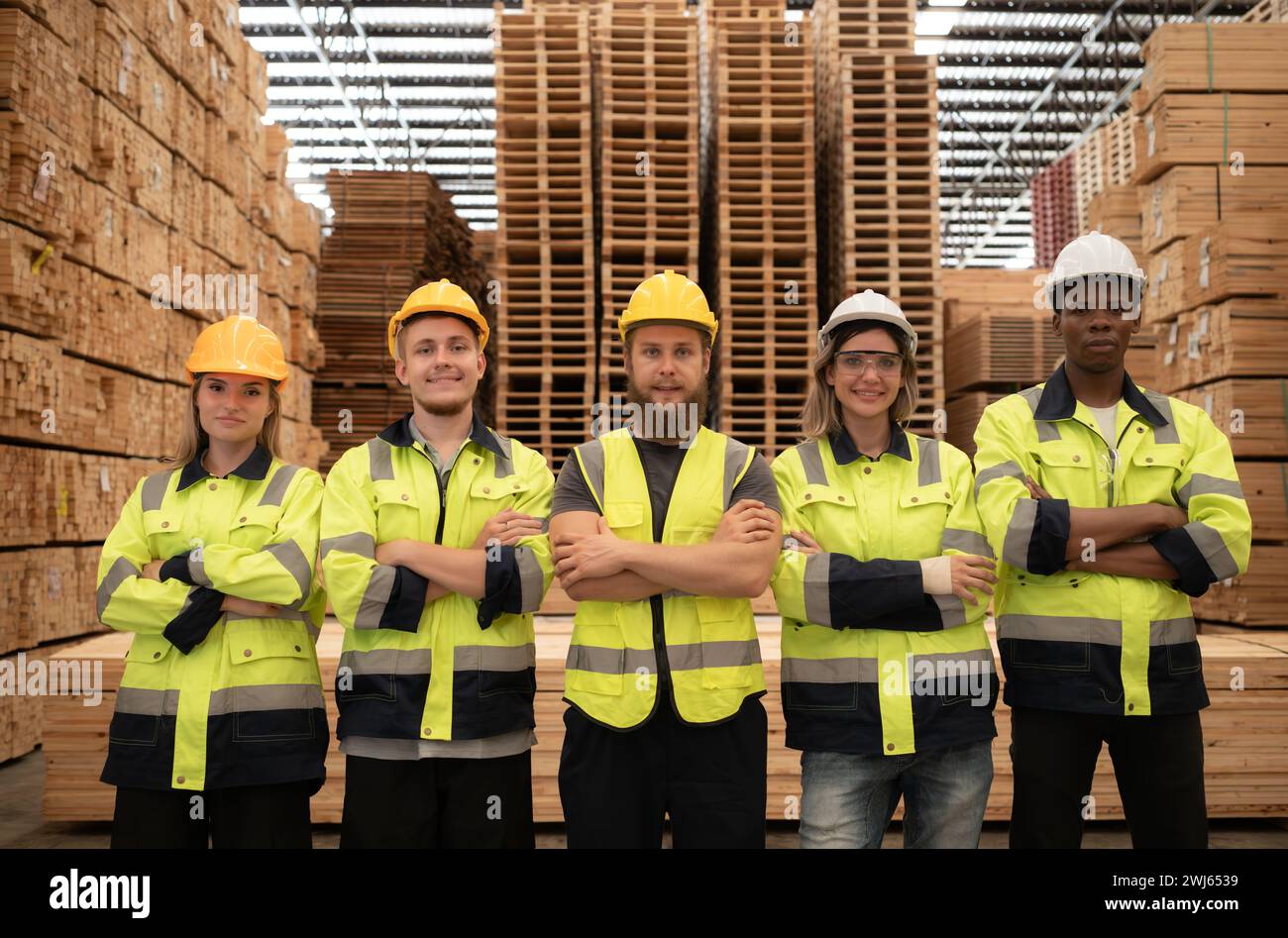 Portrait of a group of workers work in a woodworking factory, Standing ...