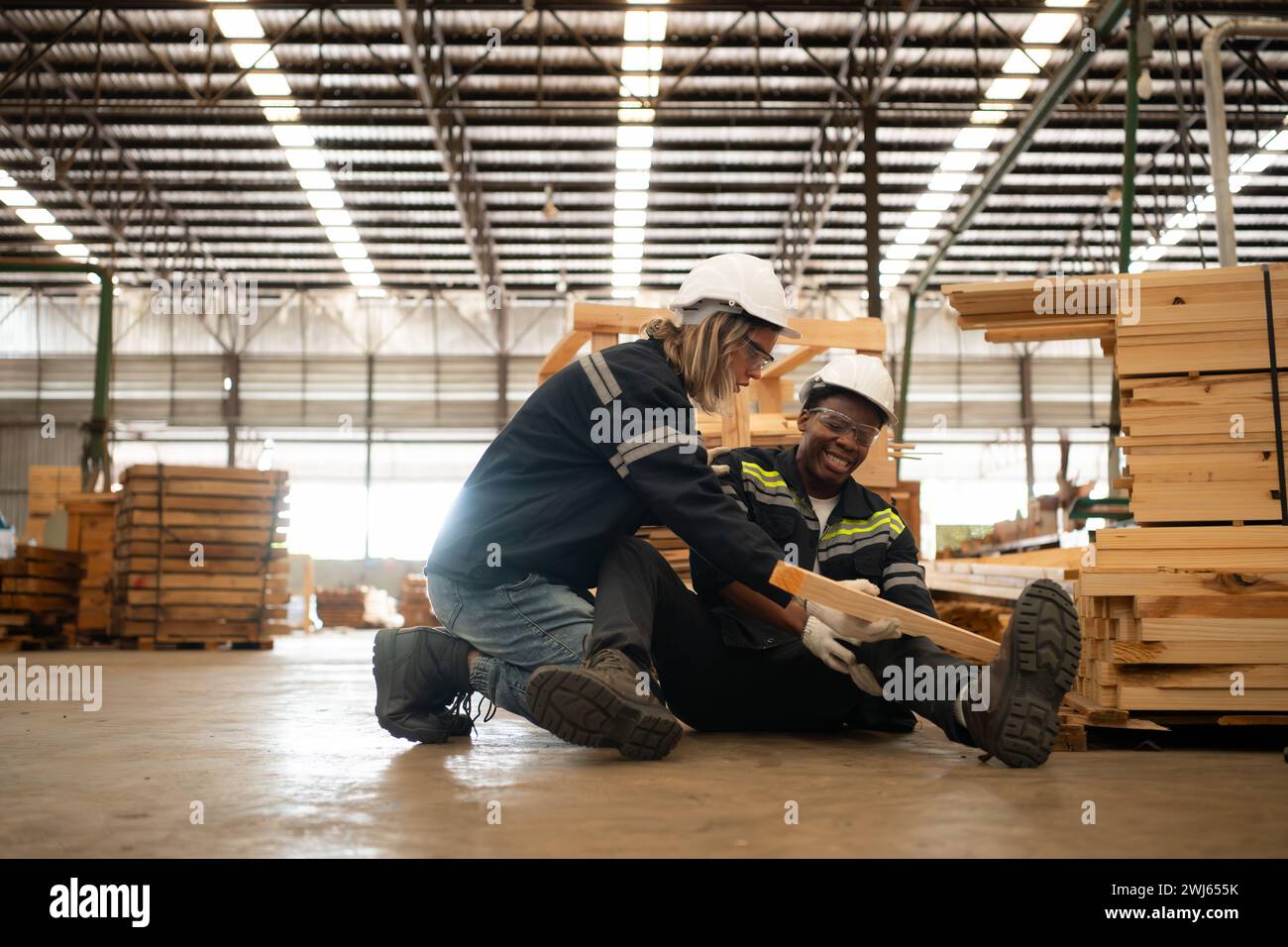 Lumber warehouse worker injured in leg, Colleagues help and support to ...