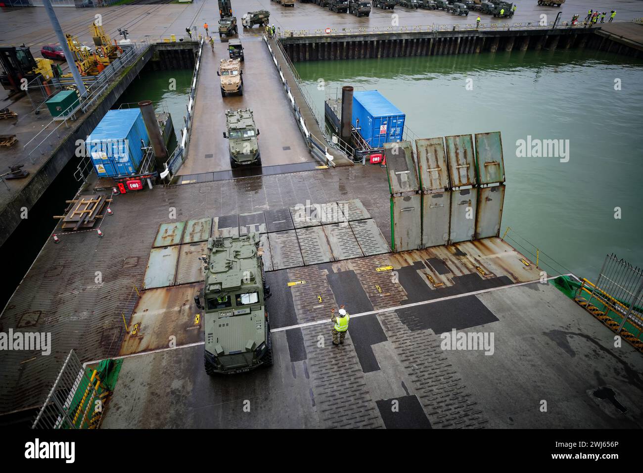 Vehicles and equipment are loaded onboard MV Anvil Point at the Sea ...