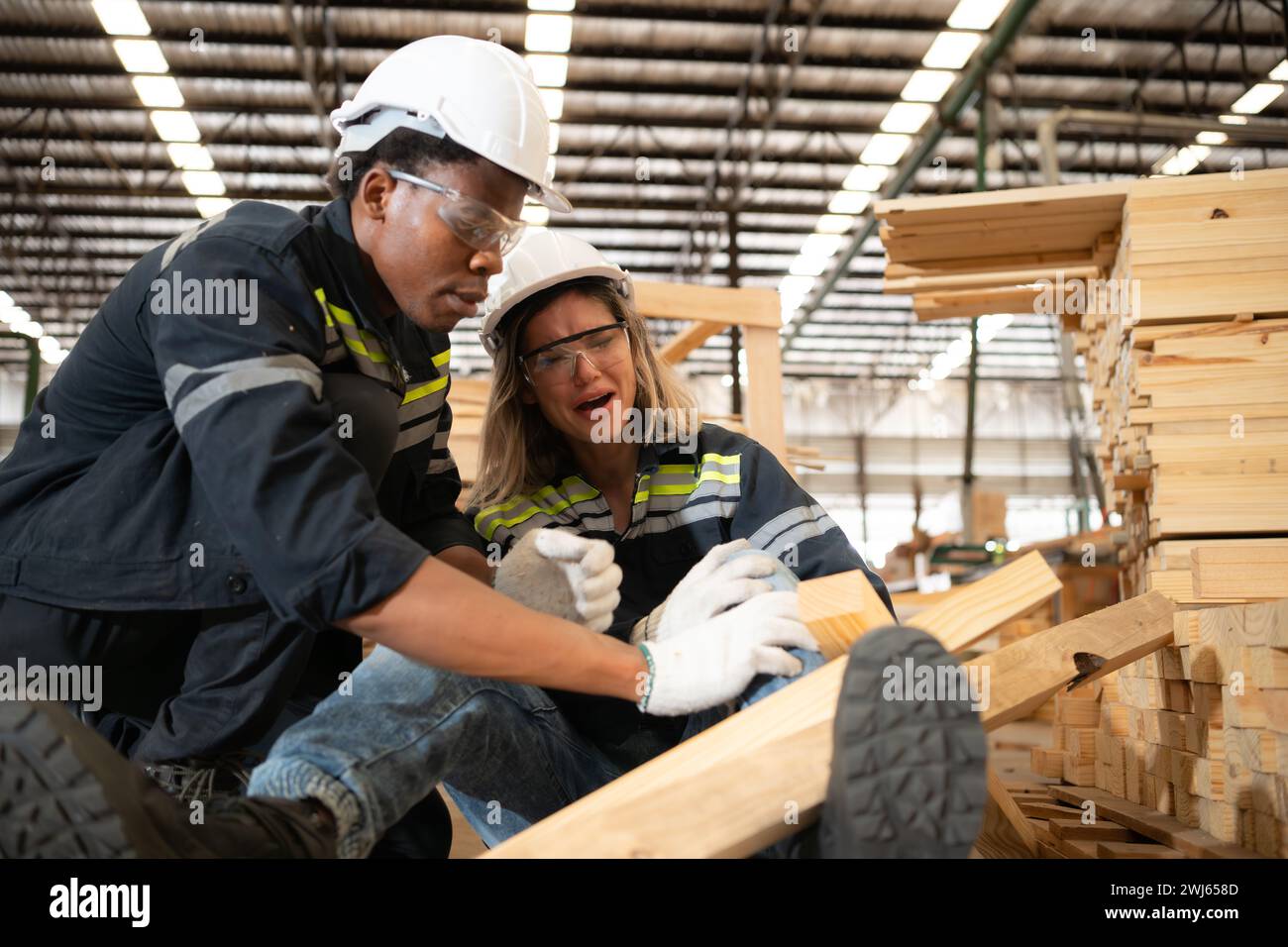 Lumber warehouse worker injured in leg, Colleagues help and support to ...