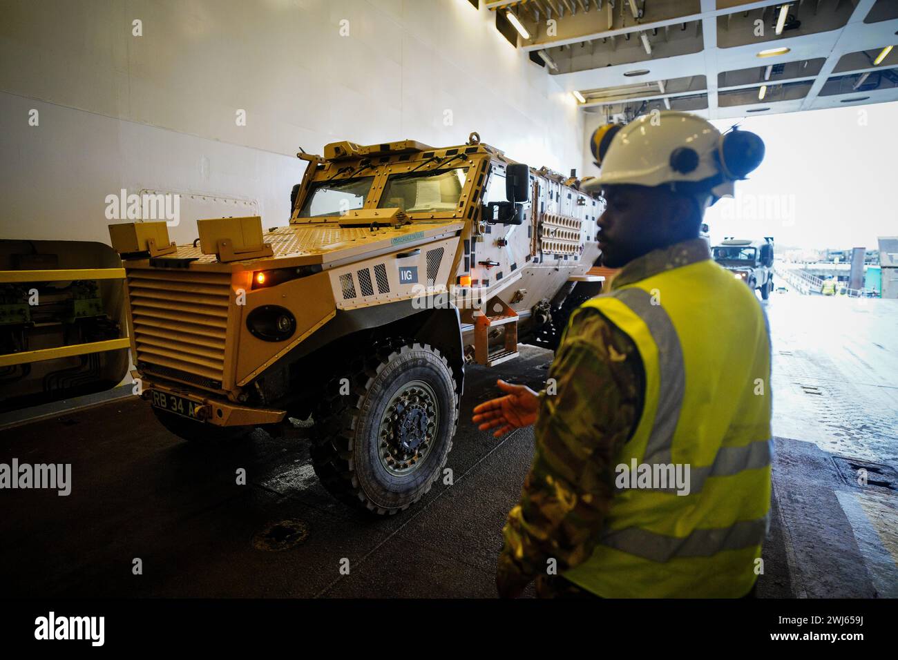 Vehicles and equipment are loaded onboard MV Anvil Point at the Sea ...