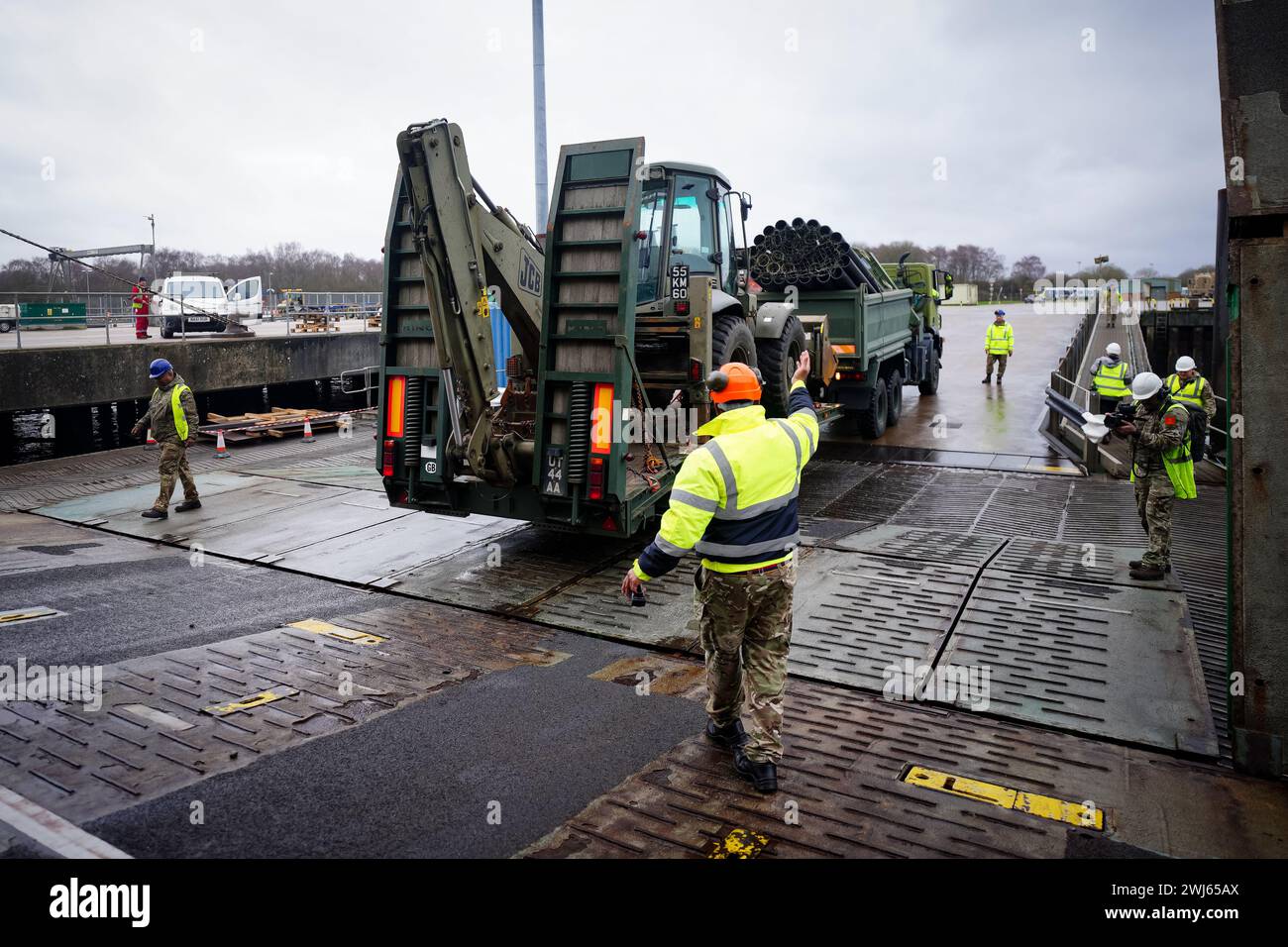 Vehicles and equipment are loaded onboard MV Anvil Point at the Sea ...