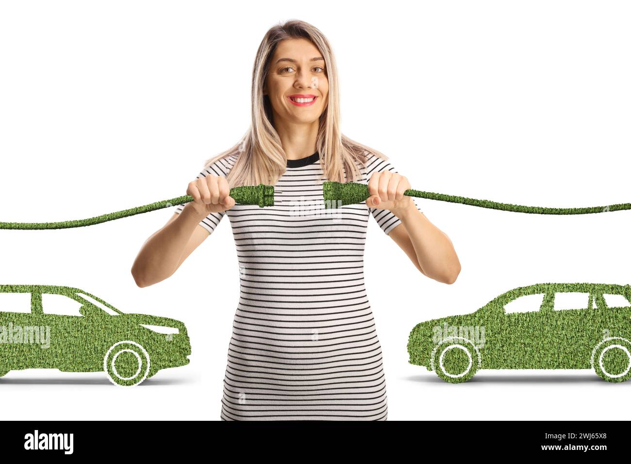 Young woman holding green cables in front of electric cars isolated on ...