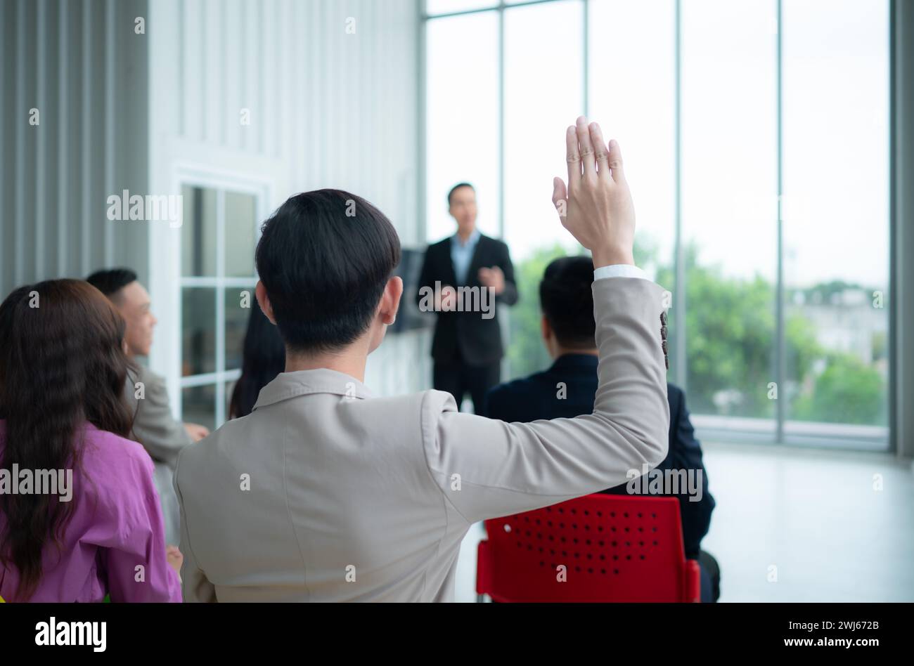 A group of business people organizes a seminar. Discuss the success of ...