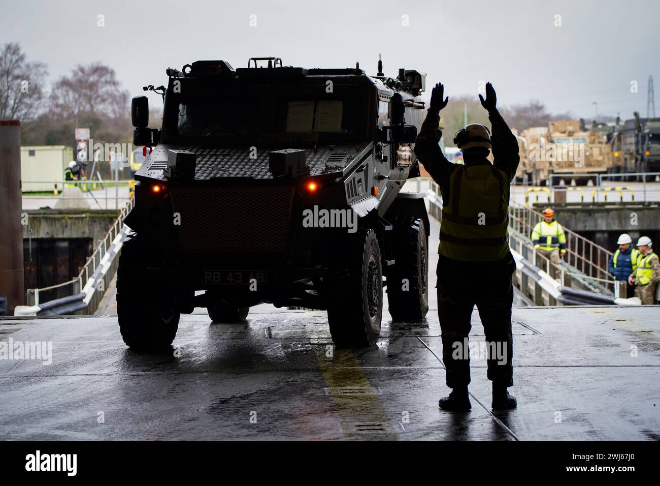 Vehicles and equipment are loaded onboard MV Anvil Point at the Sea ...