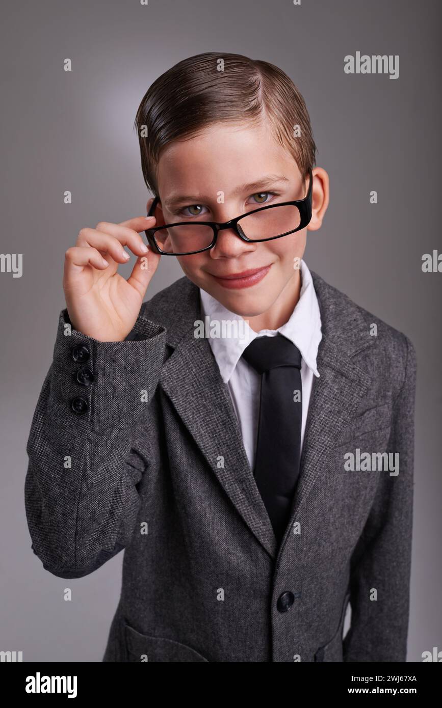 Portrait, costume and boy with glasses, suit and Halloween dress up on ...