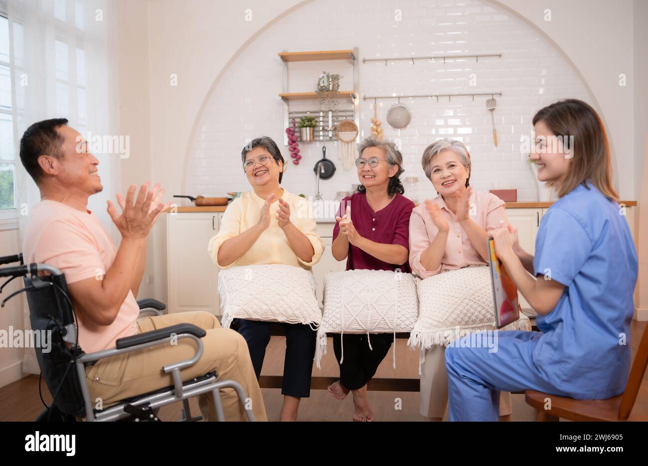 Group of elderly and senior man in wheelchair with nurse at nursing ...