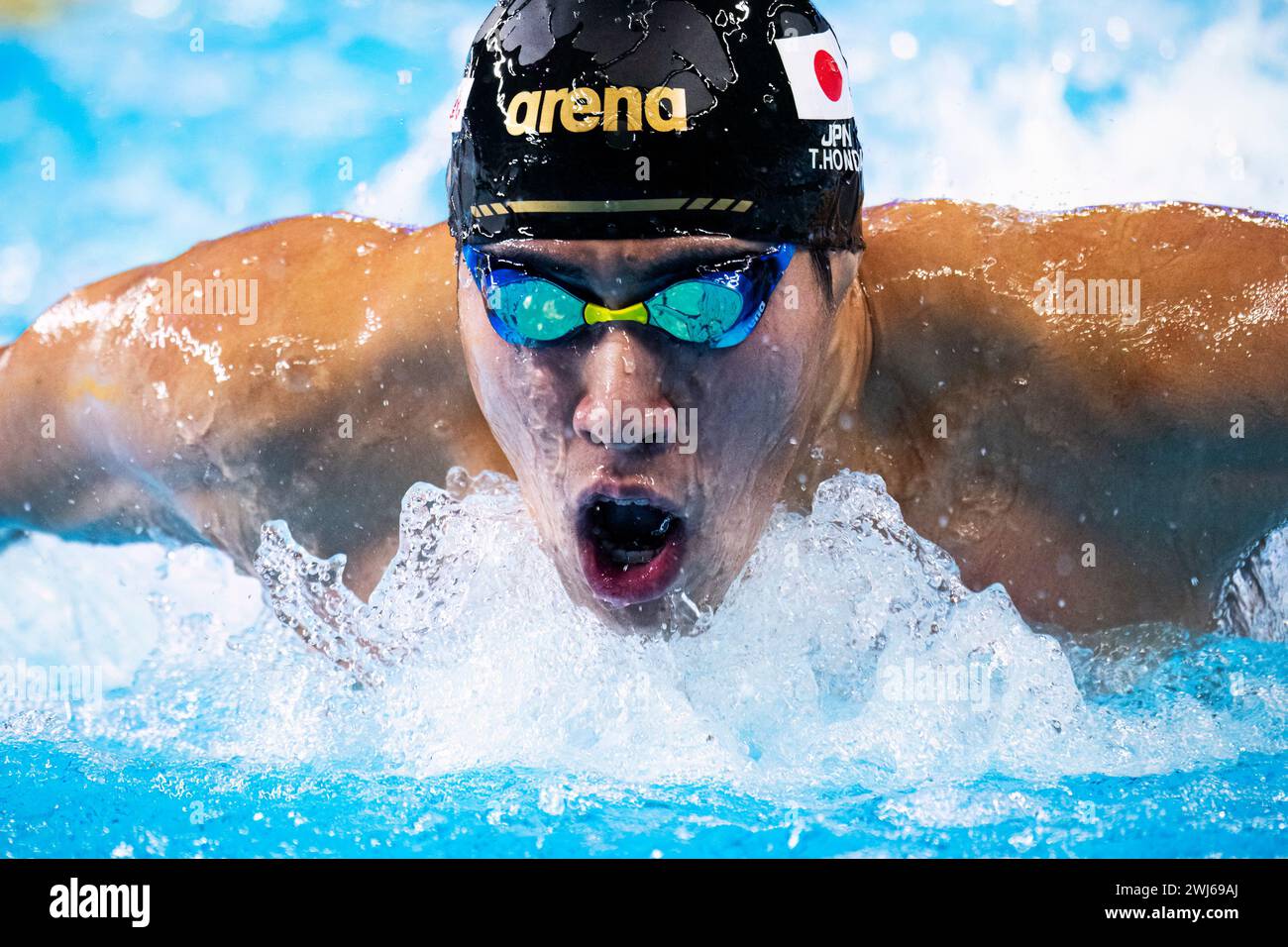 Tomoru Honda of Japan competes in the swimming men's 200m butterfly ...